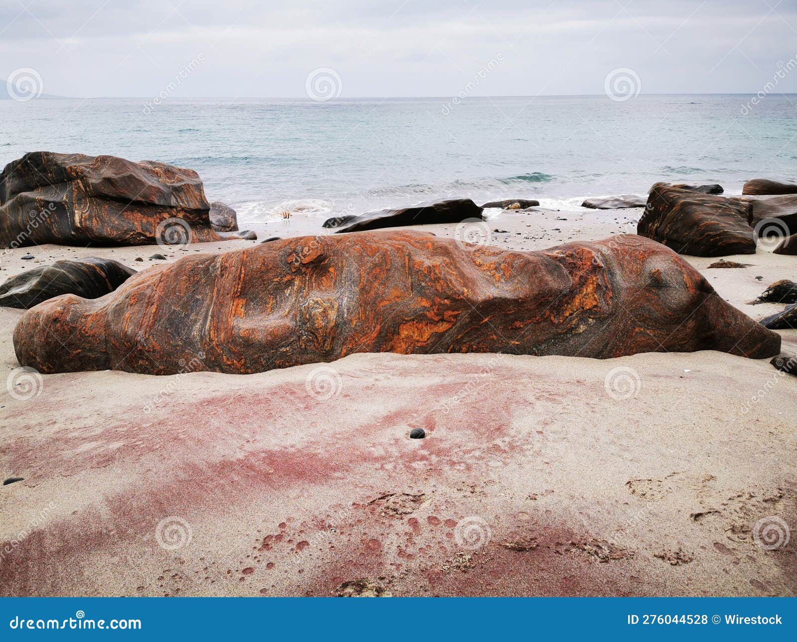 Rock Formation Looking Like a Human on a Beach Stock Photo - Image of ...