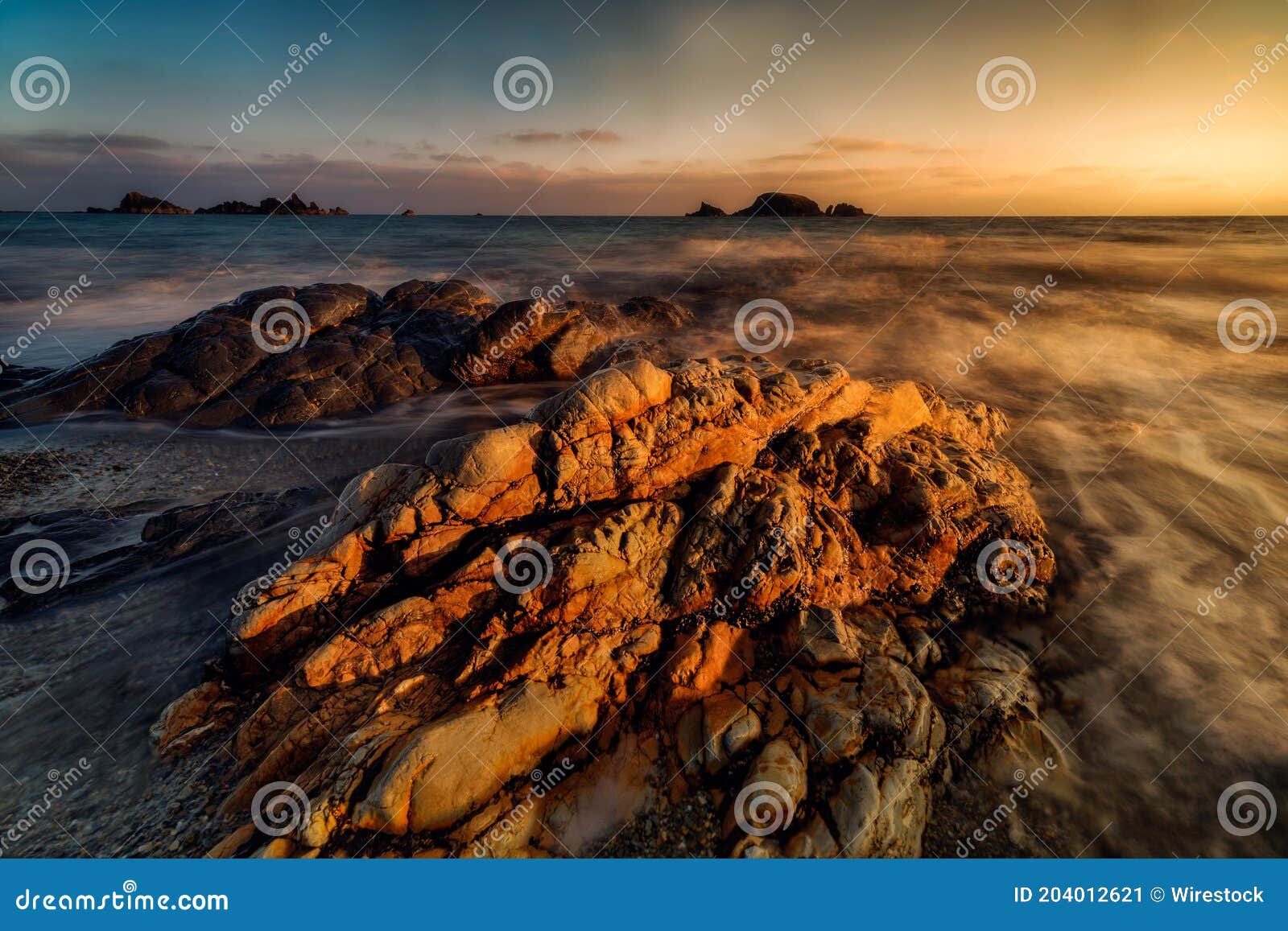 Rock Formations in the Foamy Water of the Sea at Sunset Stock Image ...