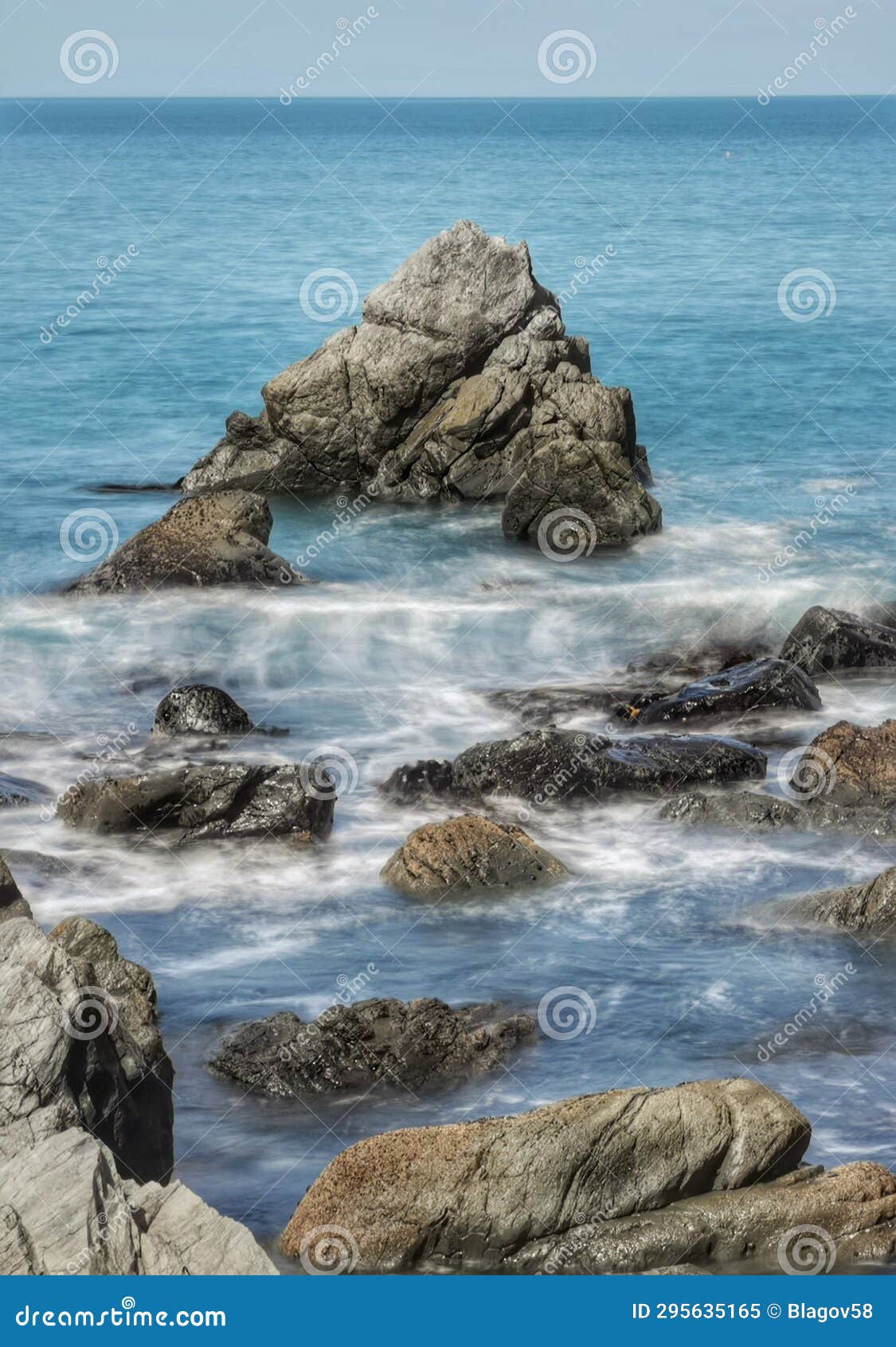 Rock Formations and Smooth Ocean Waves Vertical Abstract Background ...