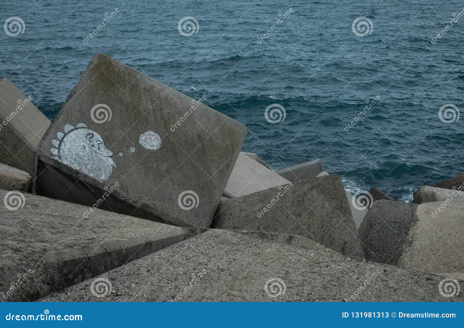 Rock Graffiti in Front of the Sea Stock Image - Image of waves ...