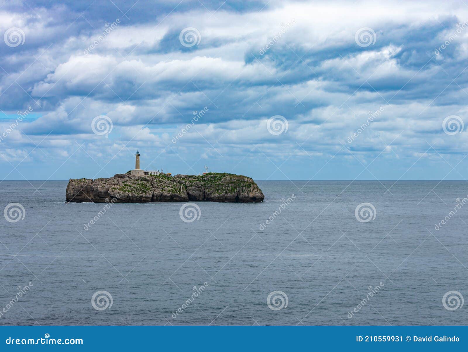 Rock Islet in the Sea with a Lighthouse Stock Image - Image of peaceful ...