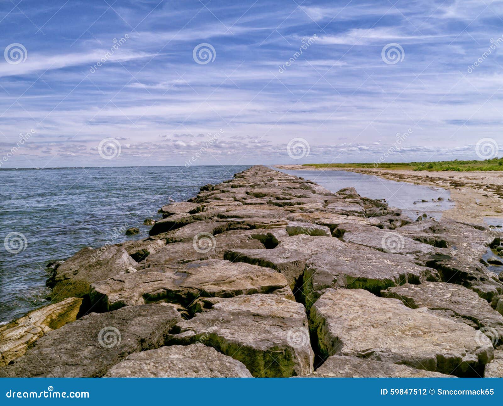 Rock jetty into ocean stock photo. Image of atlanticocean - 59847512