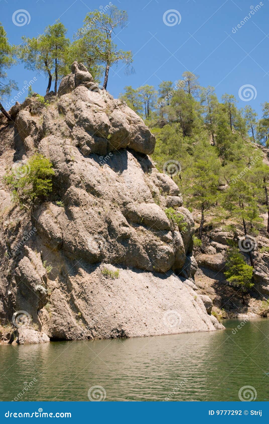 Rock in lake stock photo. Image of mountain, landscape - 9777292