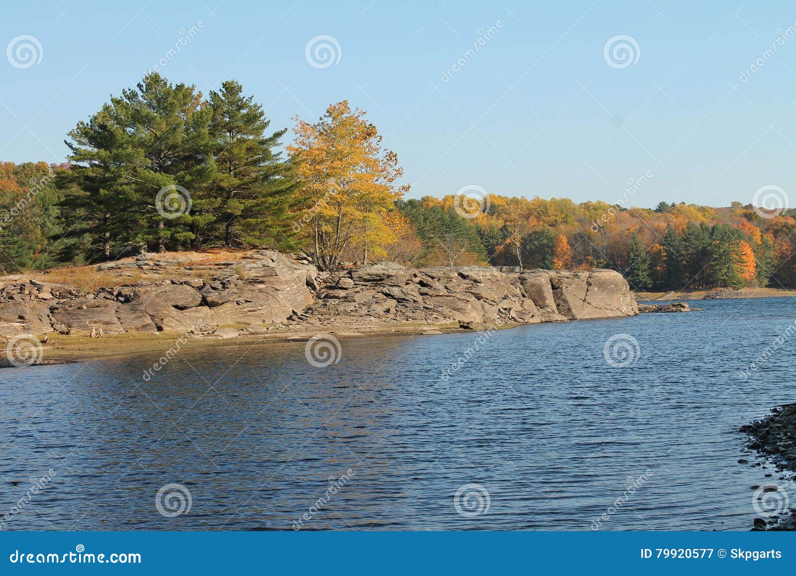 Rock Ledge on Lake Shore in Fall Stock Image - Image of ledge, green ...