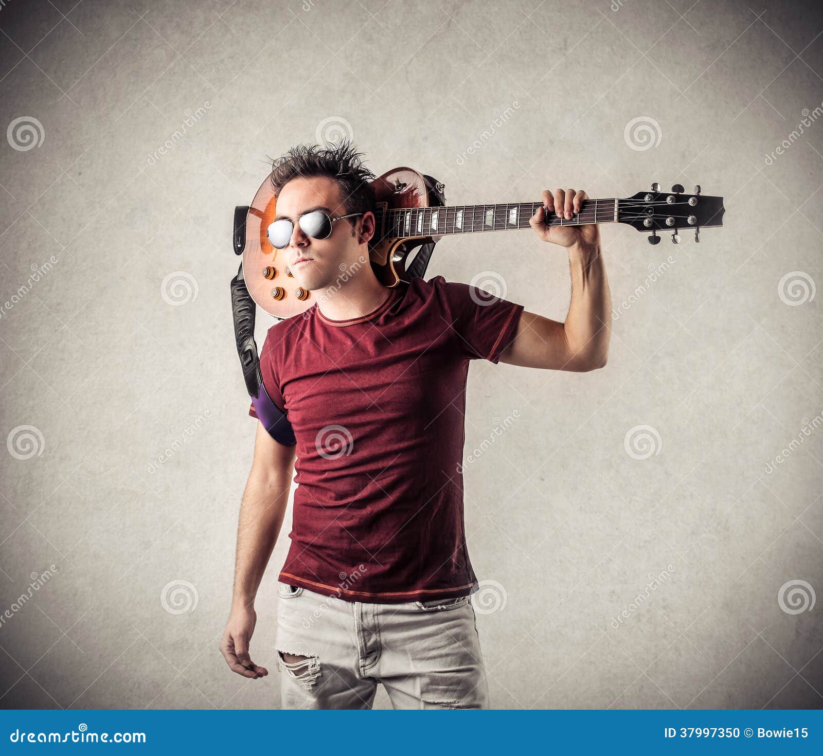 Rock man with a guitar stock photo. Image of song, jeans - 37997350