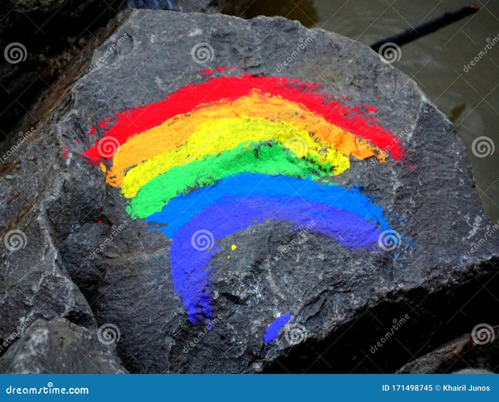 A Rock Painted with Rainbow Colors Stock Image - Image of green, yellow ...