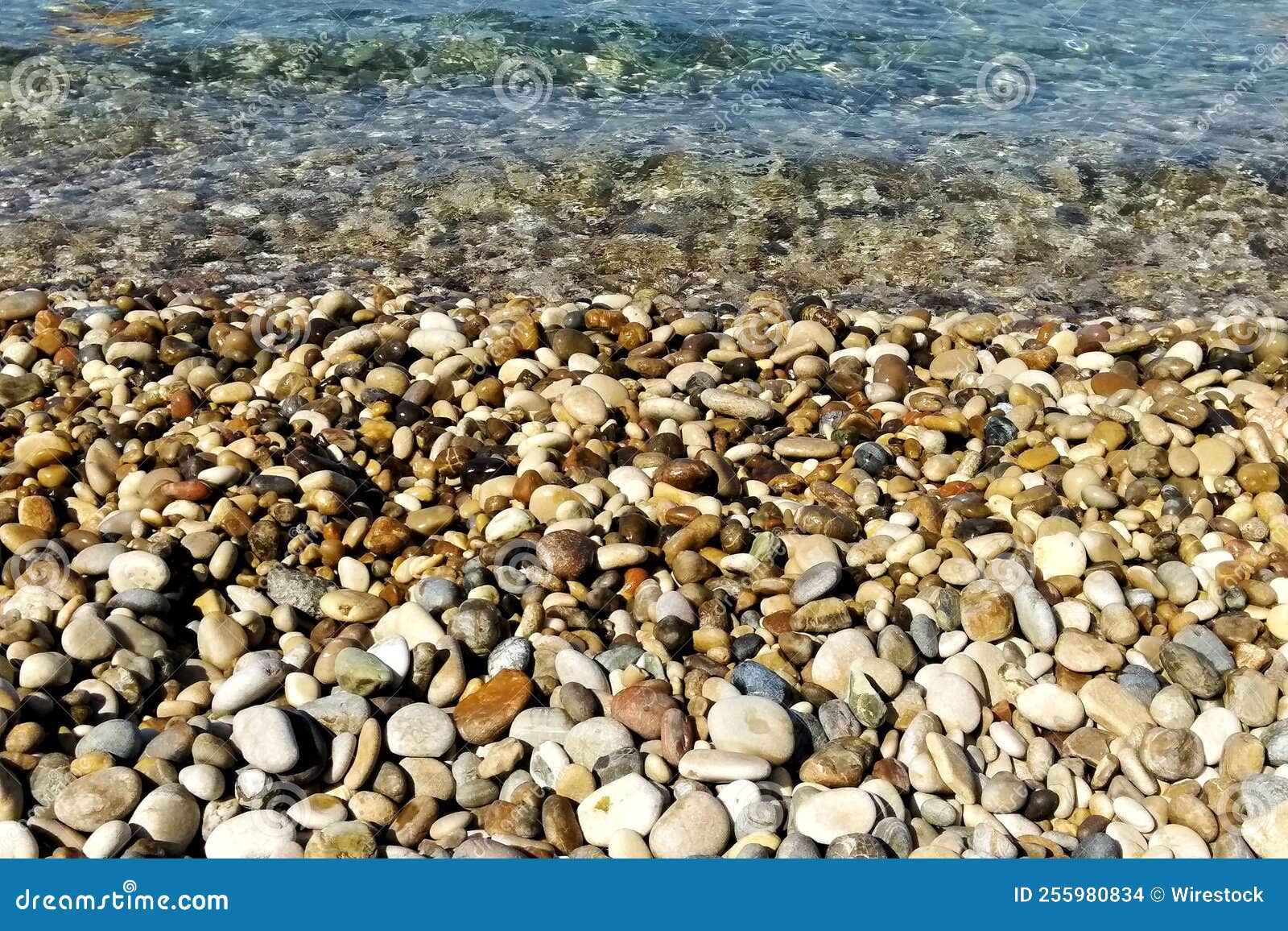 Rock and Pebbles Near the Blue Ocean Stock Photo - Image of water ...