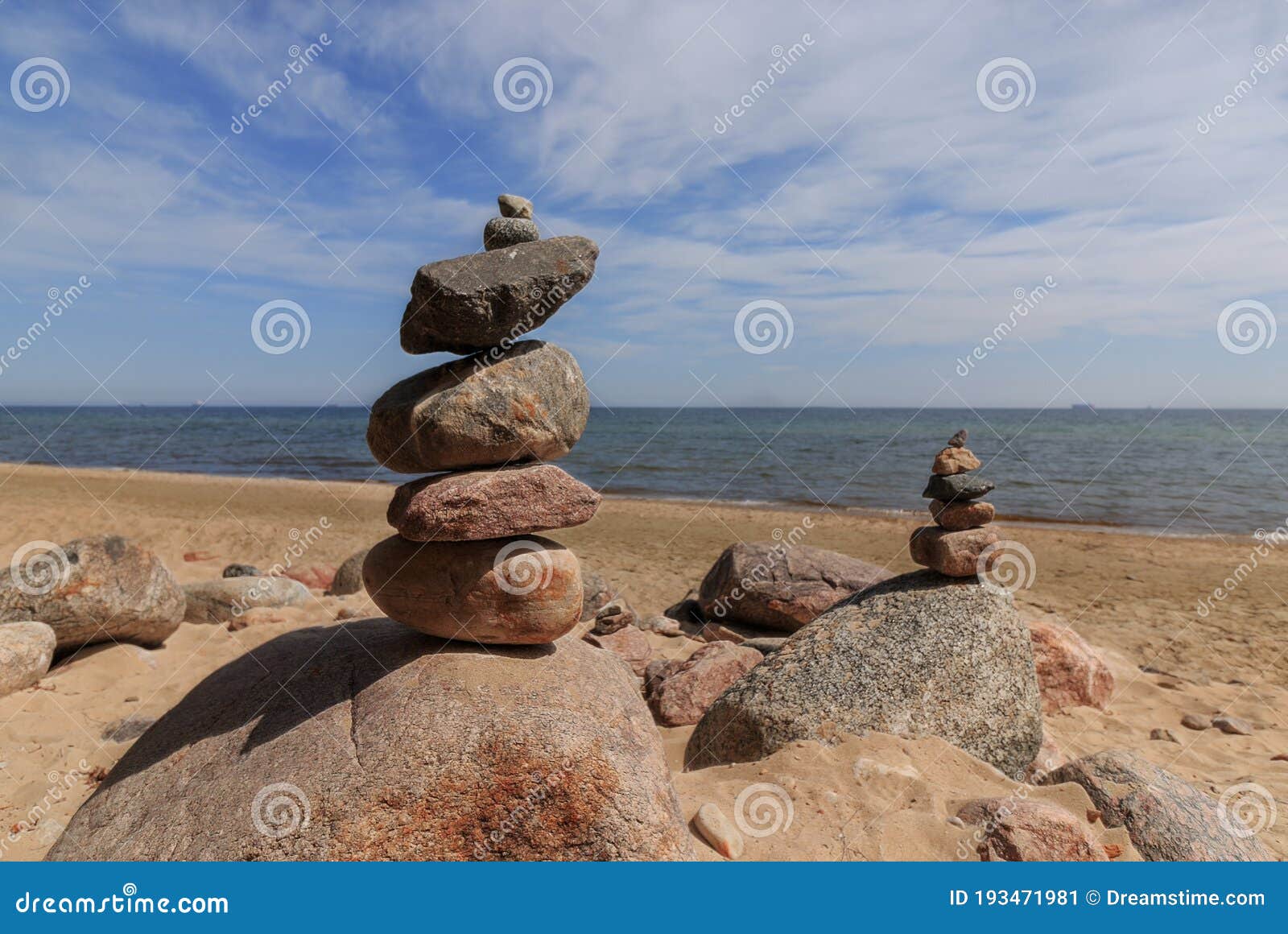 Rock pillars on the beach stock image. Image of stability - 193471981