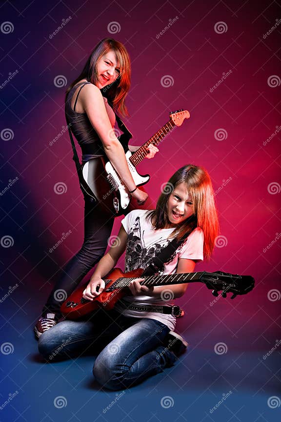 Rock and Roll girls stock image. Image of guitar, sing - 24698065