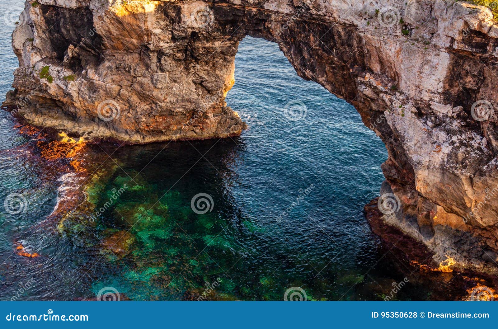 The Rock on the Sea of Colors Stock Photo - Image of boat, coastline ...