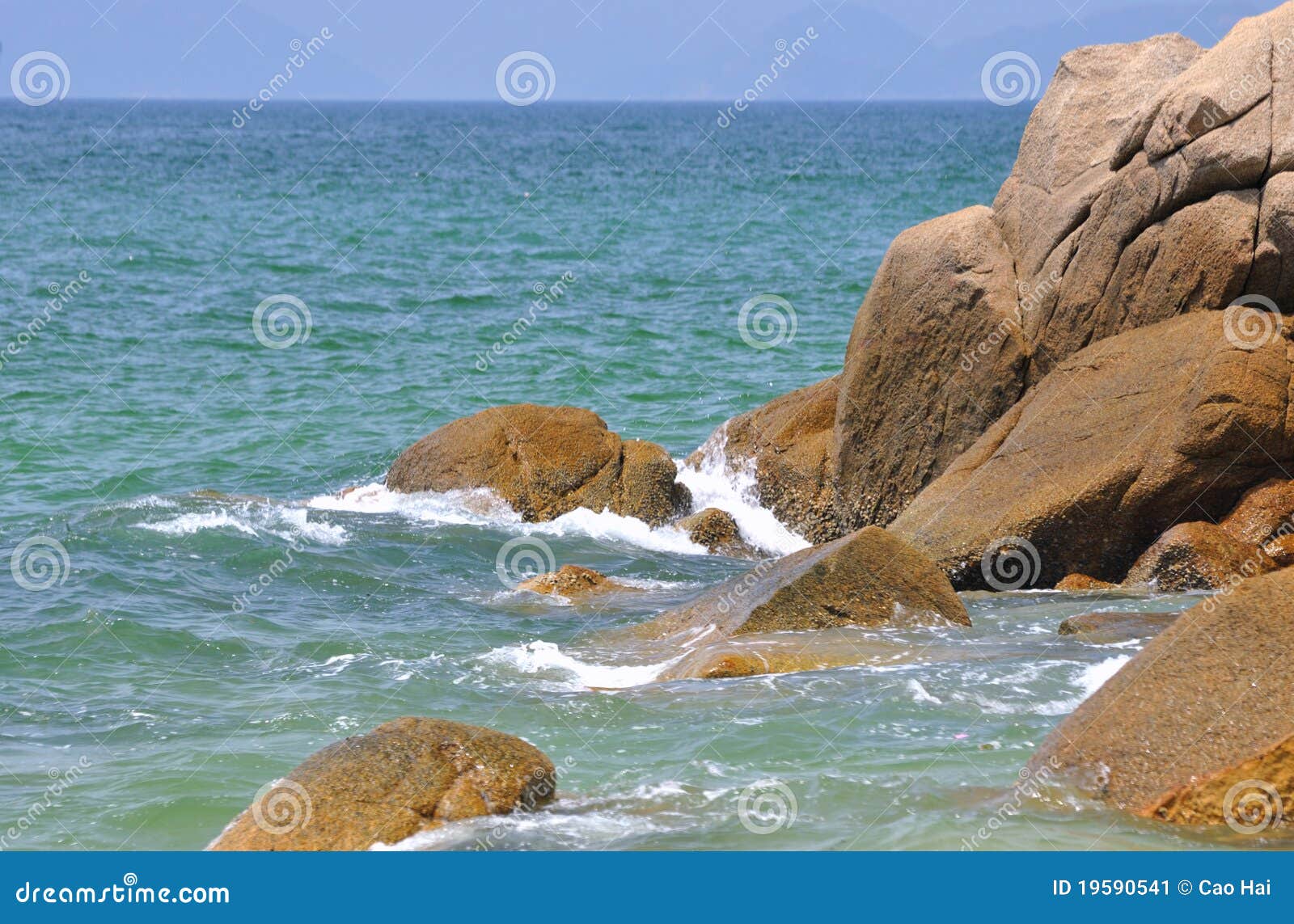 Rock at sea shore stock image. Image of shore, ochre - 19590541