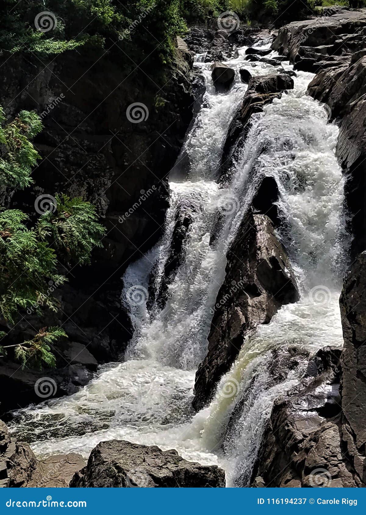 Rock-split waterfall stock image. Image of fast, flowing - 116194237
