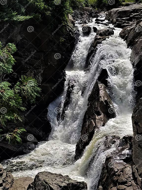 Rock-split waterfall stock image. Image of fast, flowing - 116194237