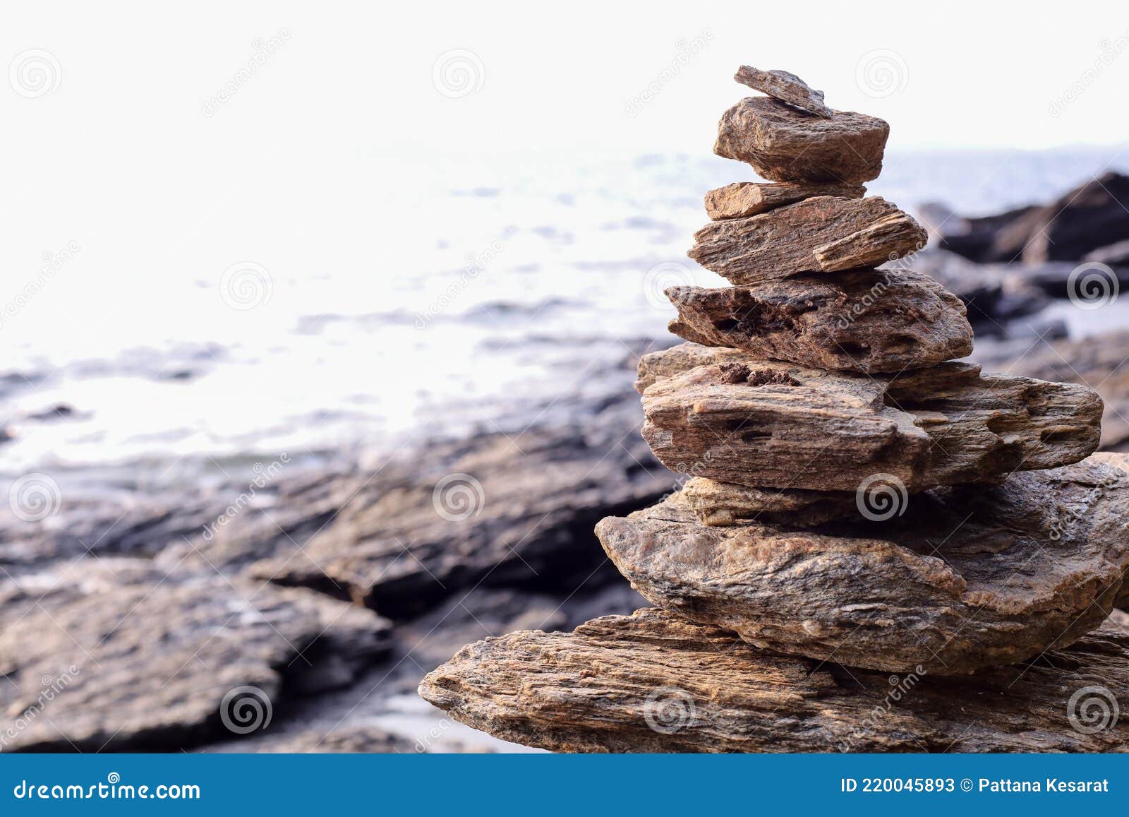 Rock stacks on the beach stock image. Image of success - 220045893