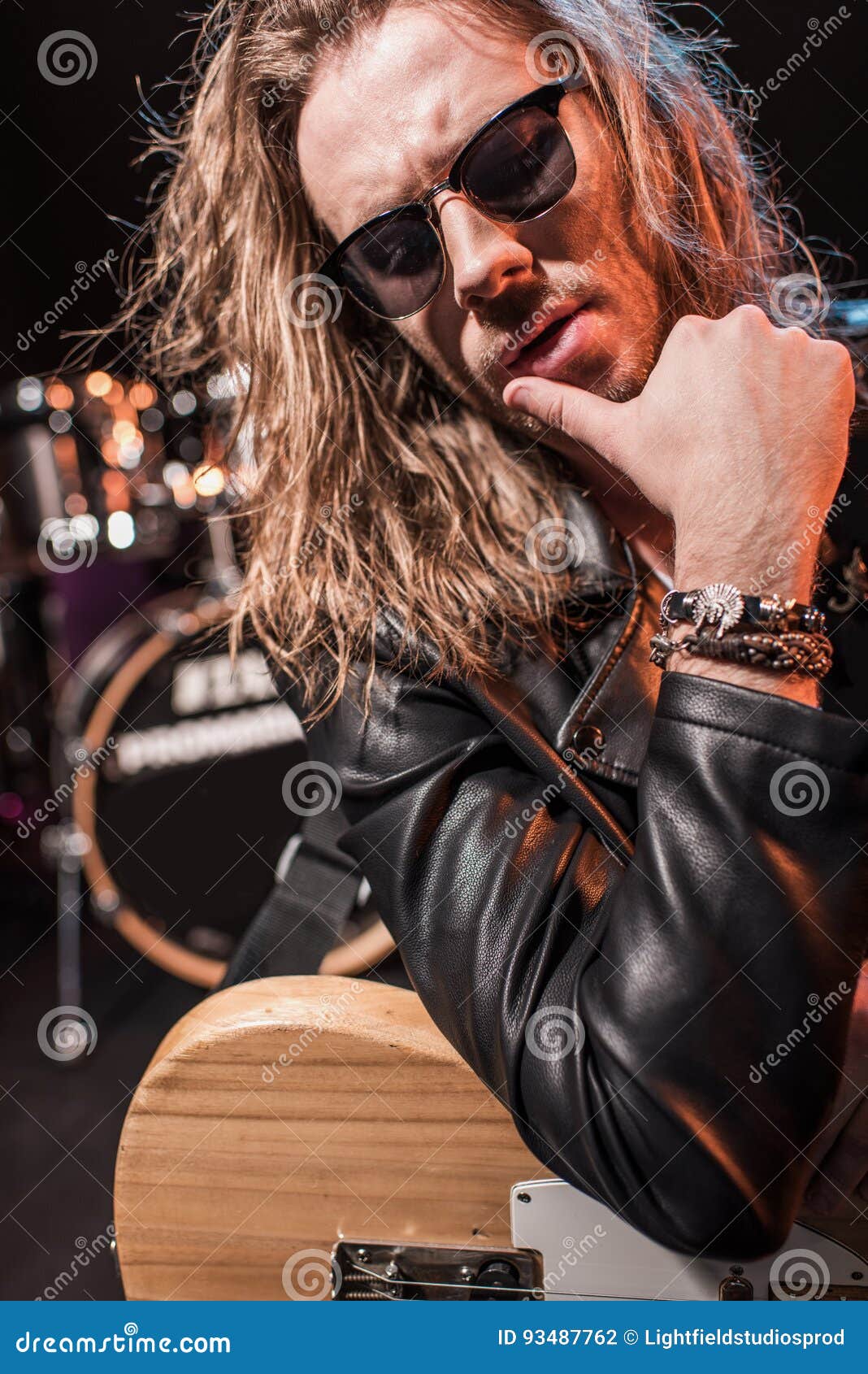 Rock Star in Eyeglasses Posing with Electric Guitar on Stage Stock ...