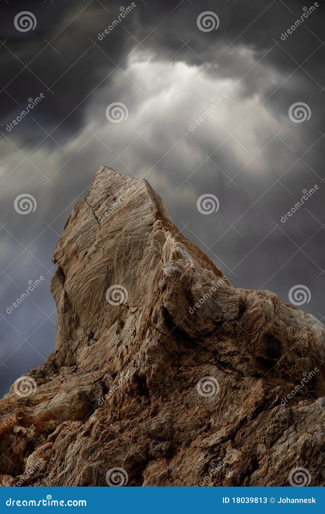 Rock in stormy clouds stock image. Image of cloud, season - 18039813