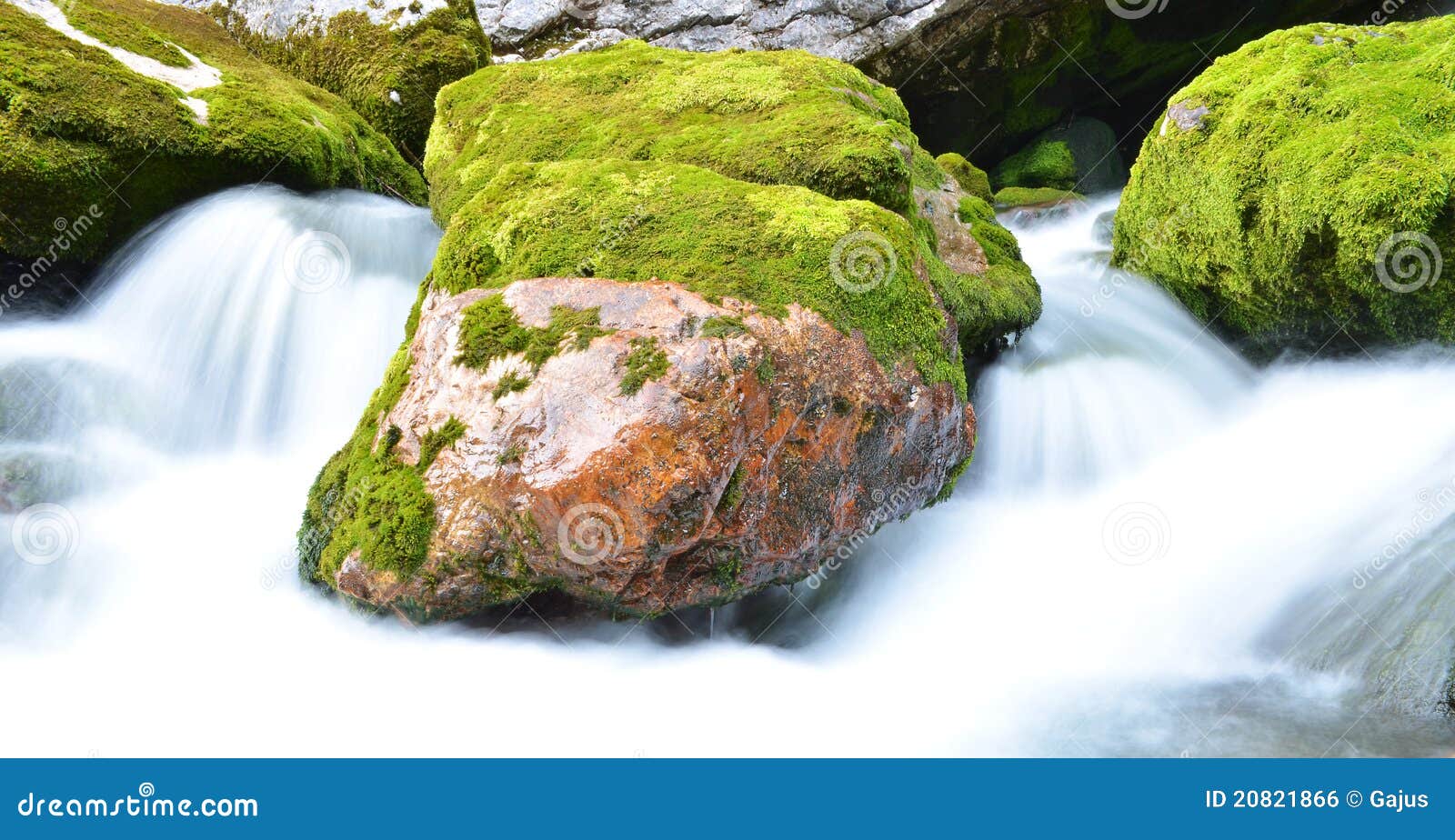 Rock in a stream of water stock photo. Image of brook - 20821866