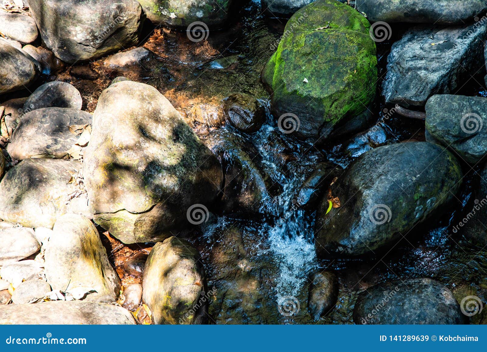 Rock with Water Flowing Slowly in Sapan Waterfall Stock Image - Image ...