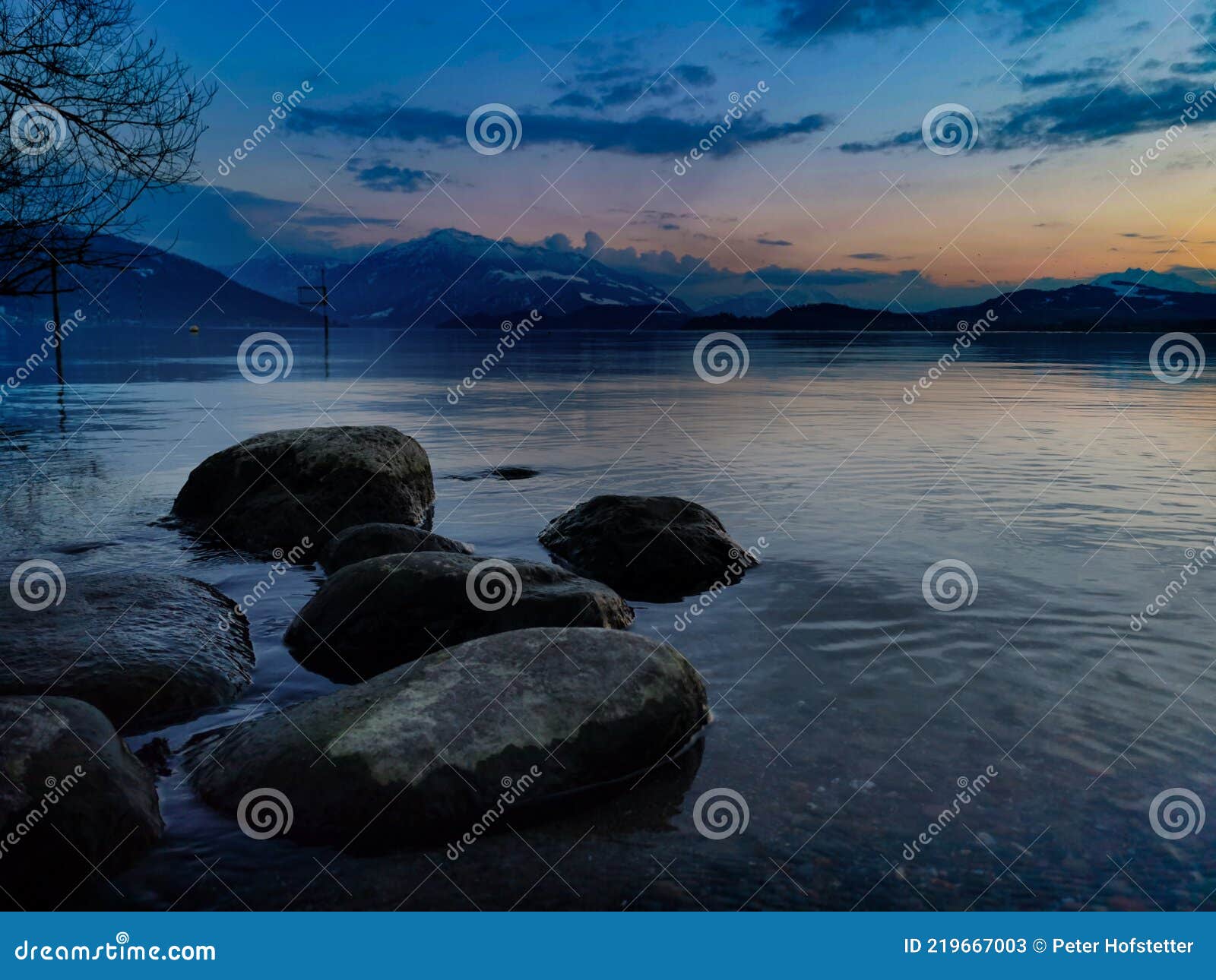 Rock in Water in Lake Zug with Mount Rigi Stock Image - Image of rock ...