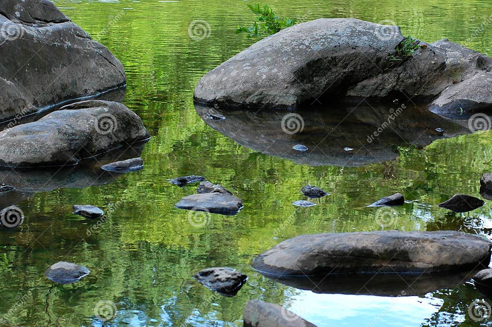 Rock, water, reflection stock image. Image of soft, water - 499893