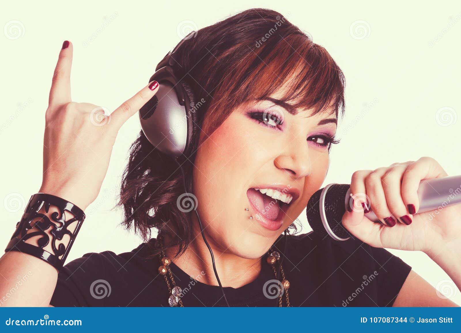 Rocker Girl Singing stock photo. Image of pretty, microphone - 107087344
