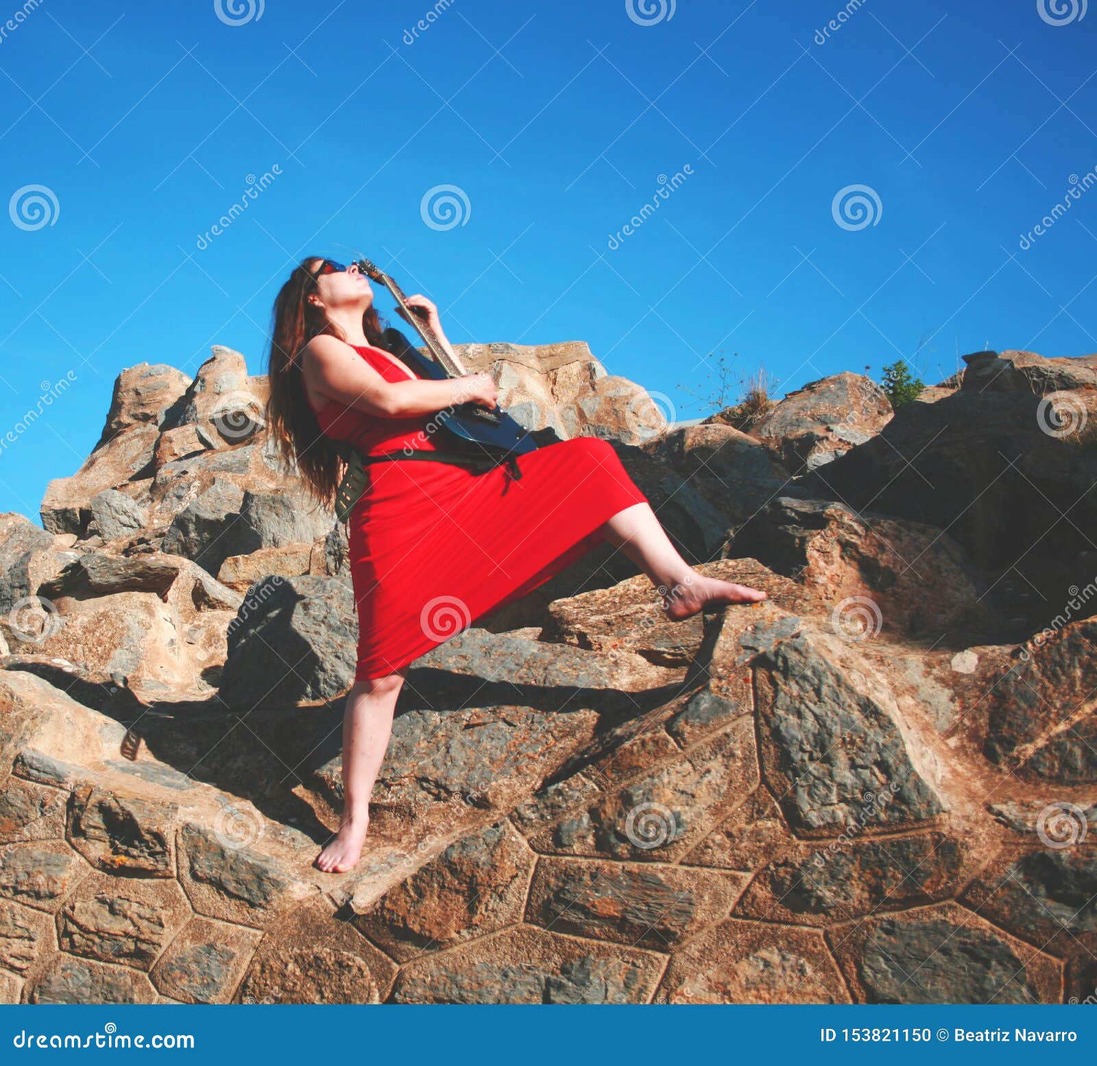 ROCKING OVER the ROCKS stock photo. Image of dress, young - 153821150