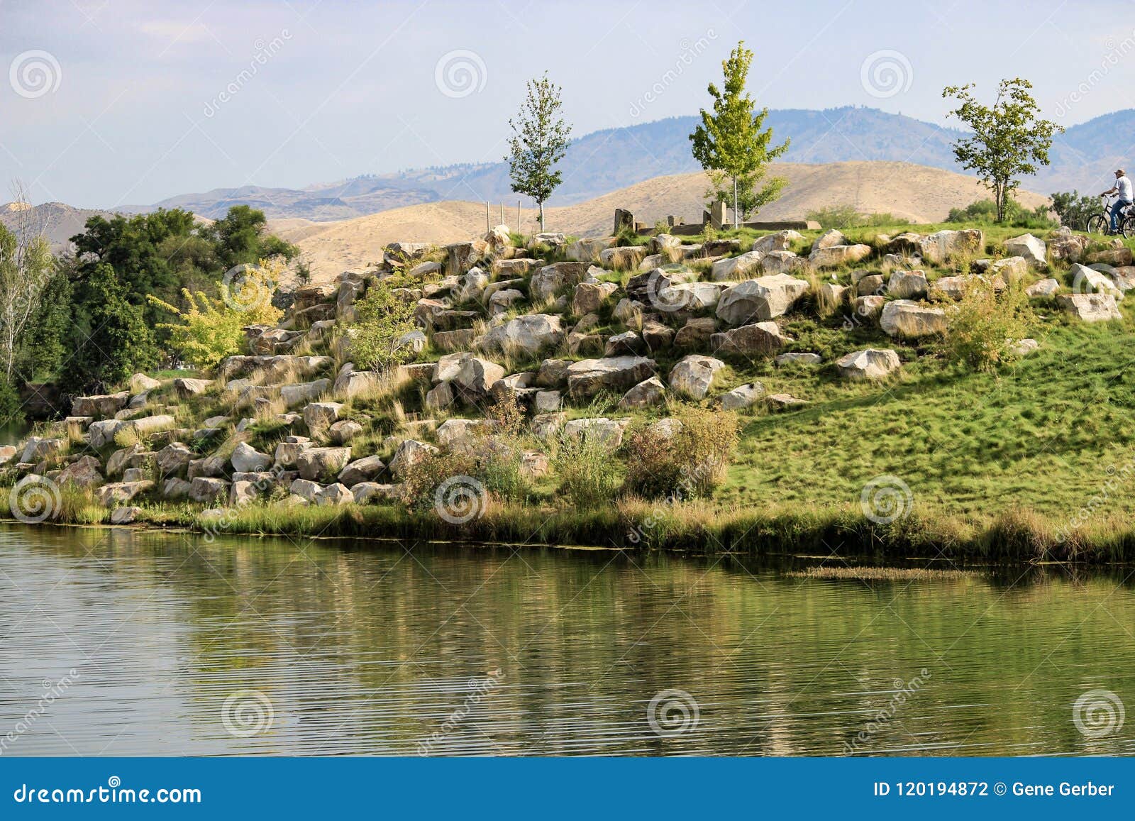 Rocks Above the River stock photo. Image of lake, pond - 120194872