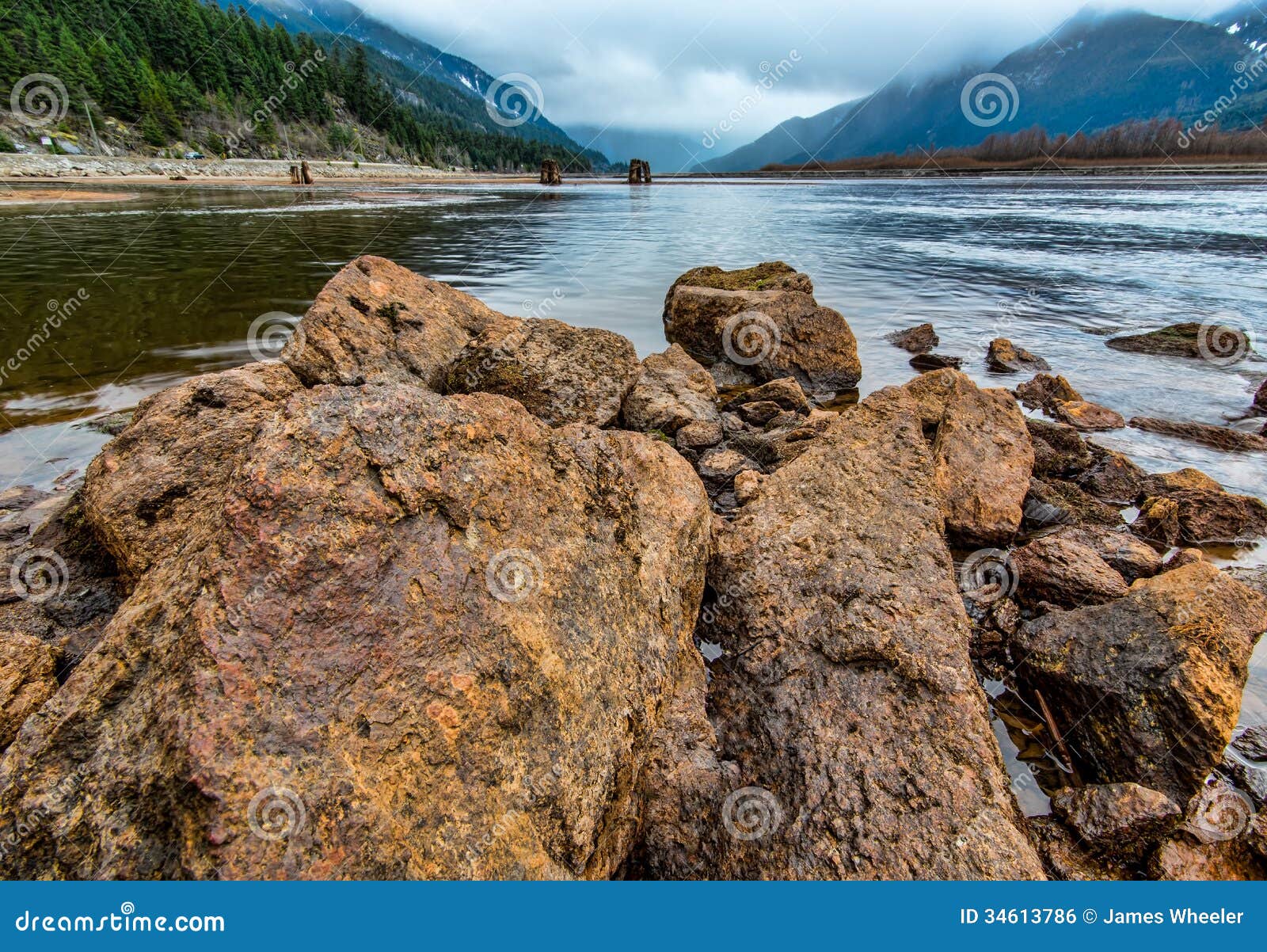 Rocks Along Shore of Lake stock photo. Image of moody - 34613786
