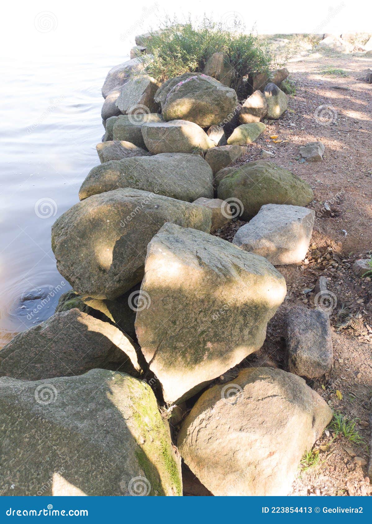 Rocks Around a Lake in a Shiny Day Stock Image - Image of shiny, rocks ...