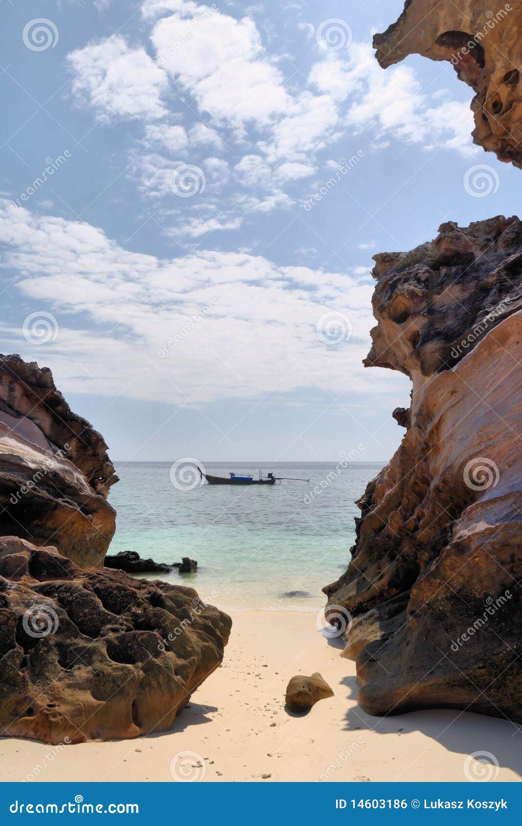 Rocks on the Beach, Boat on the Sea Beyond Stock Photo - Image of boat ...