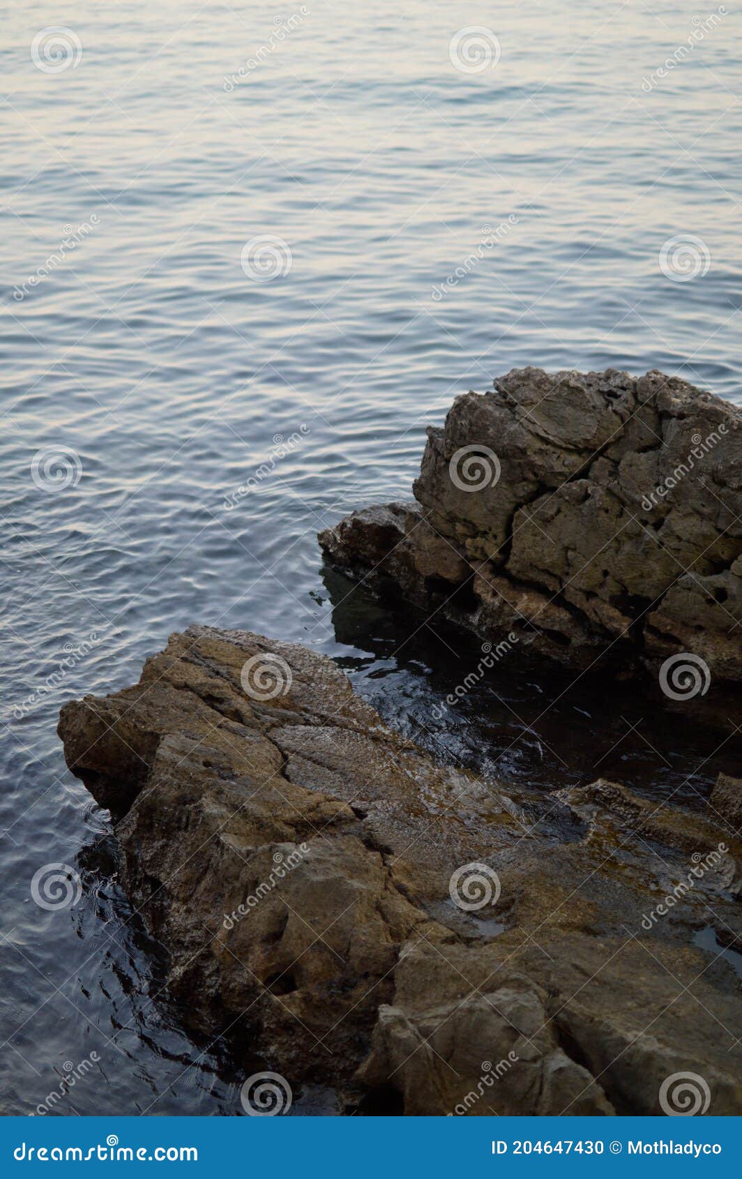 Rocks at the Beach, Calm Water Stock Photo - Image of wave, motion ...