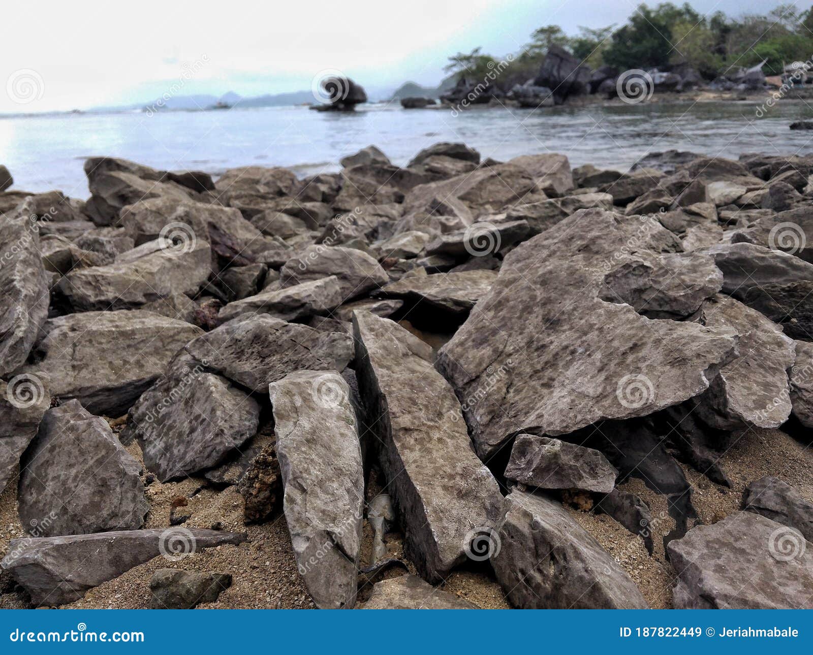 Big rocks on the beach stock image. Image of stones - 187822449