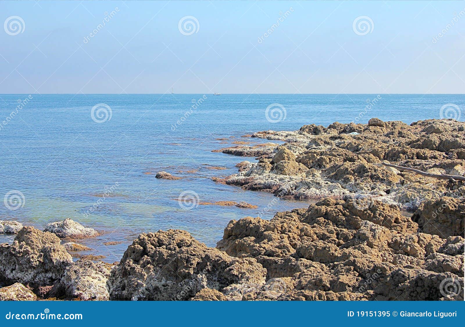 Rocks in the blue ocean stock image. Image of beautiful - 19151395