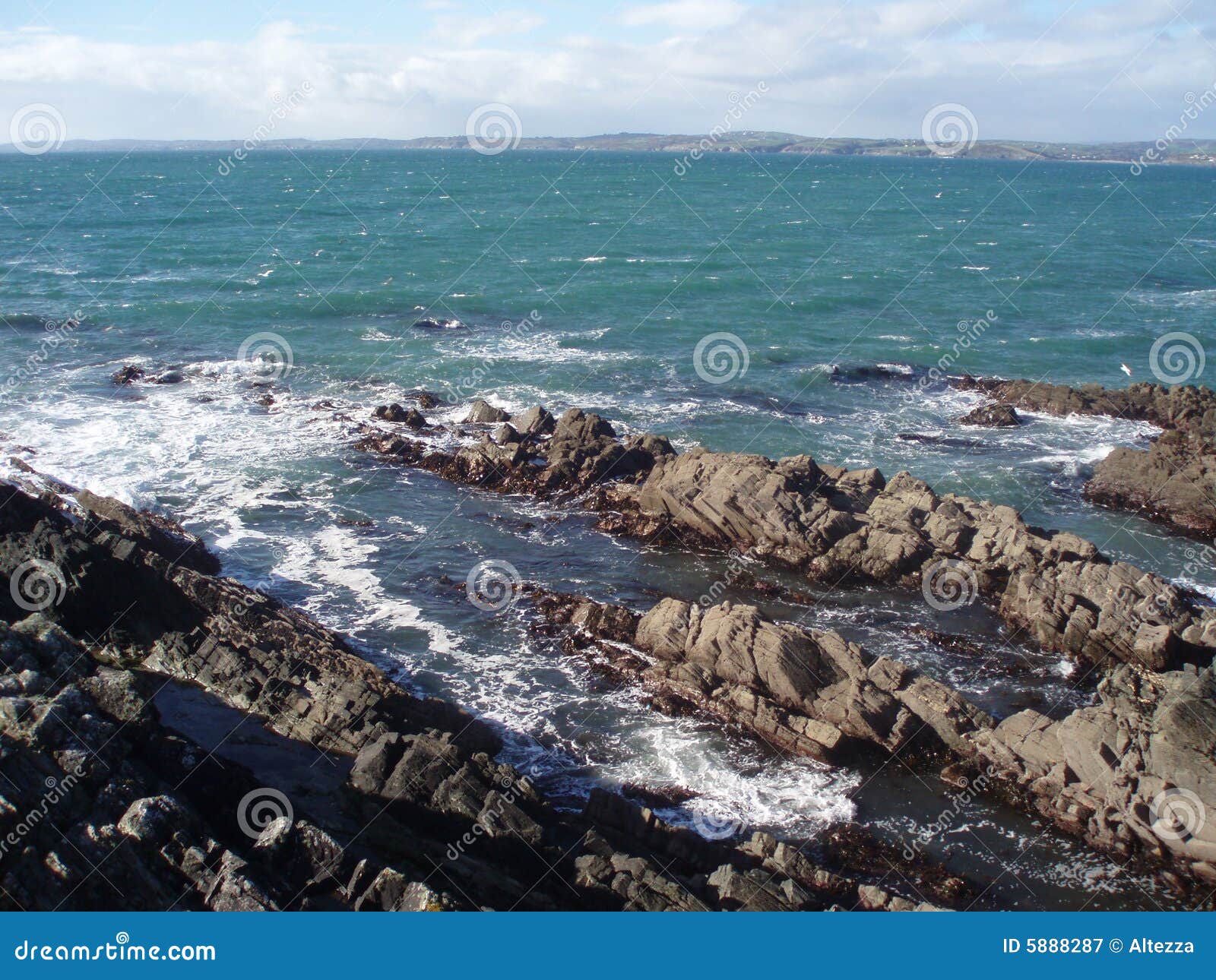 Rocks by blue sea, Ireland stock image. Image of cork - 5888287