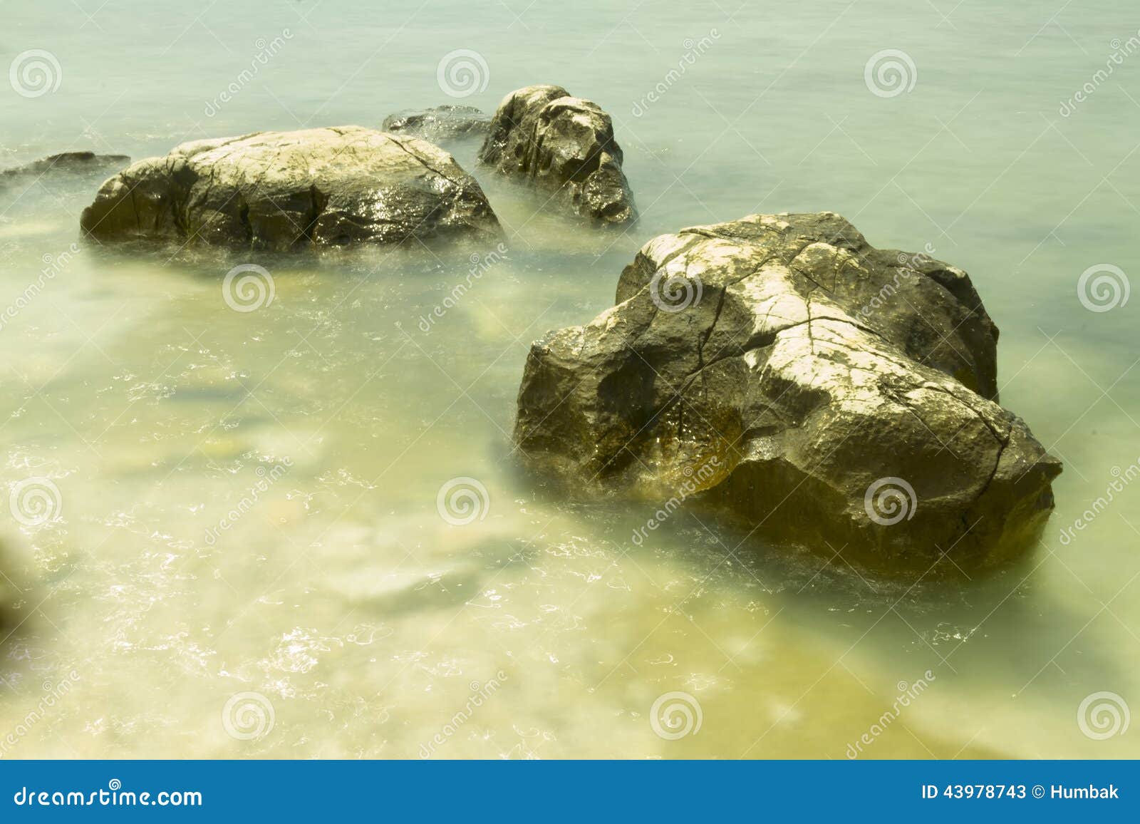 Rocks in blur water stock image. Image of closeup, long - 43978743
