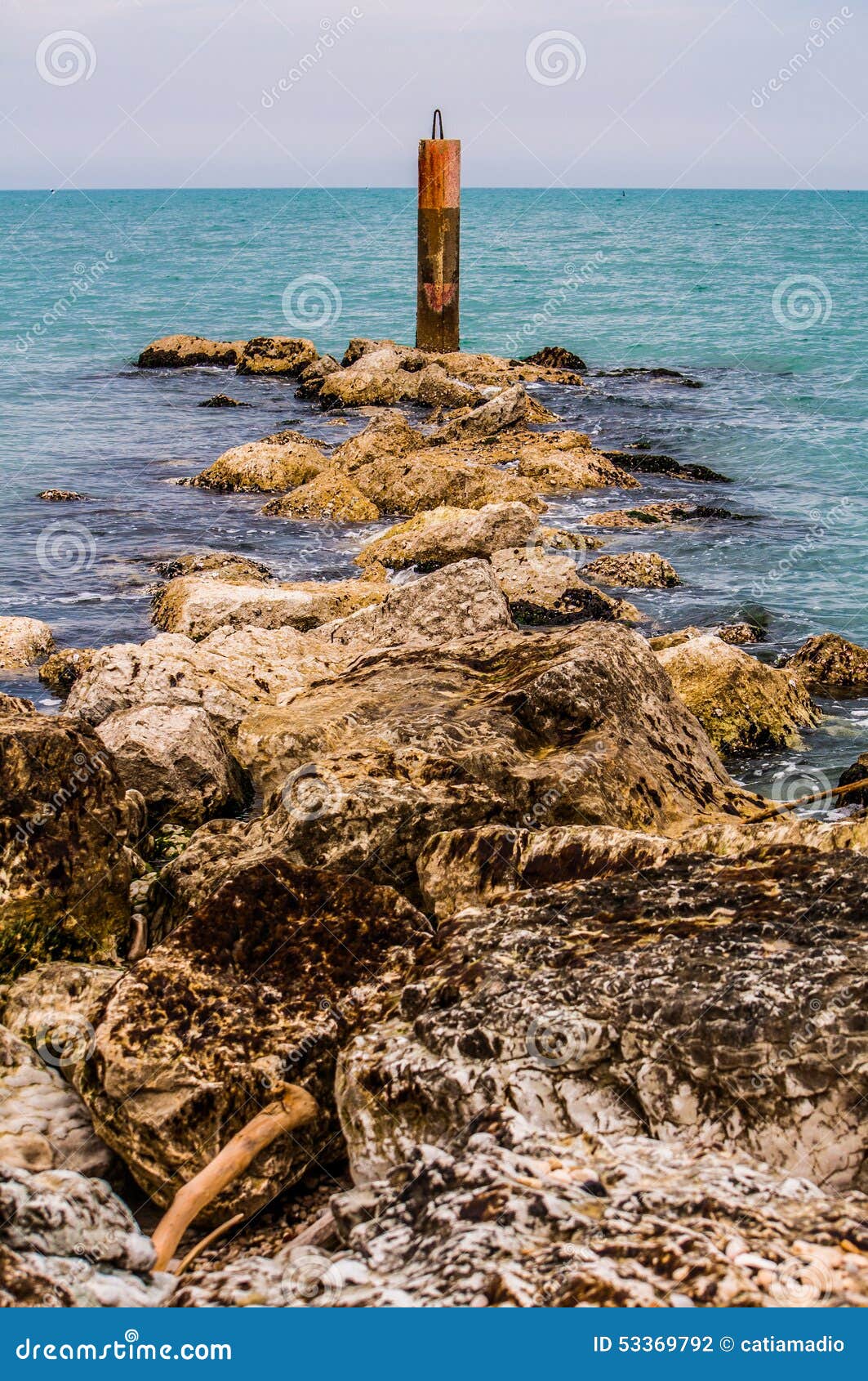 Rocks on the coast stock photo. Image of beach, waves - 53369792