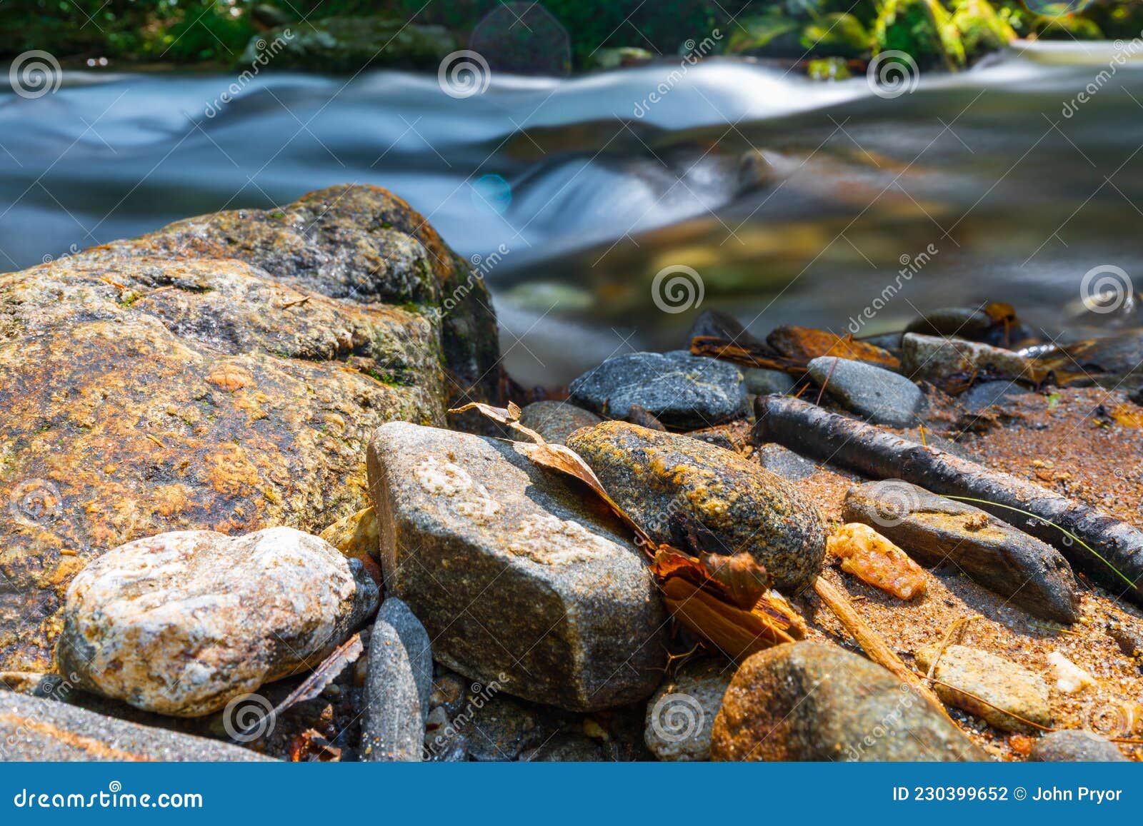 Rocks in a creek stock photo. Image of rapid, stream - 230399652