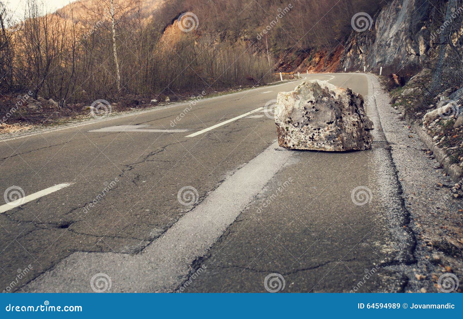 Rocks dropped on the road stock image. Image of mountain - 64594989