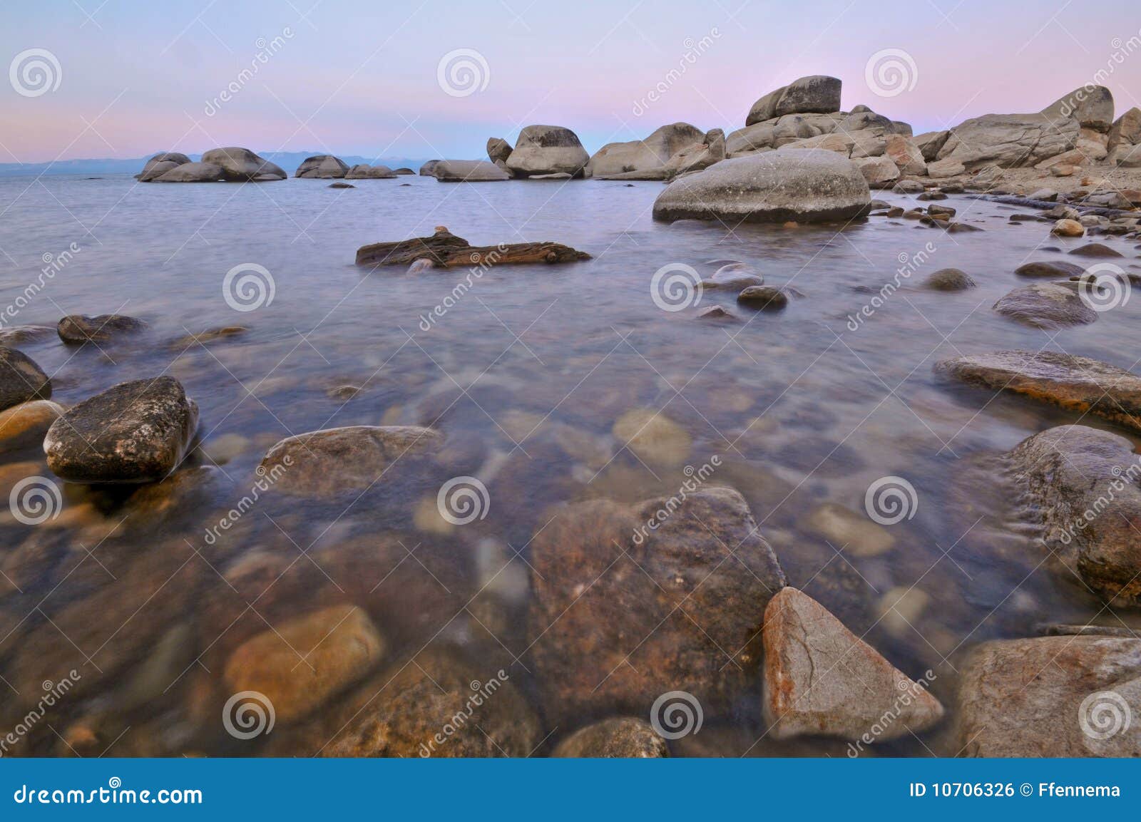 Rocks by a lake stock photo. Image of coast, bedrock - 10706326