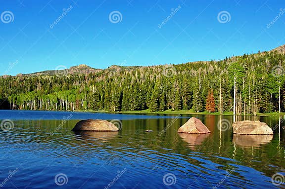 Rocks in Lake stock image. Image of blue, outdoors, water - 14897865