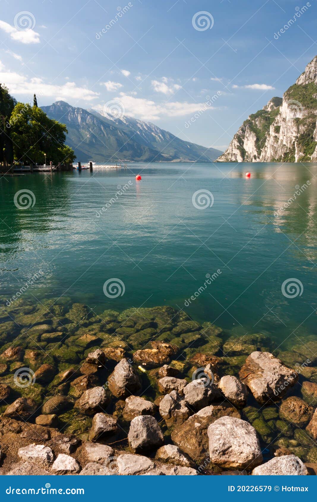 On the rocks by the lake stock image. Image of peace - 20226579