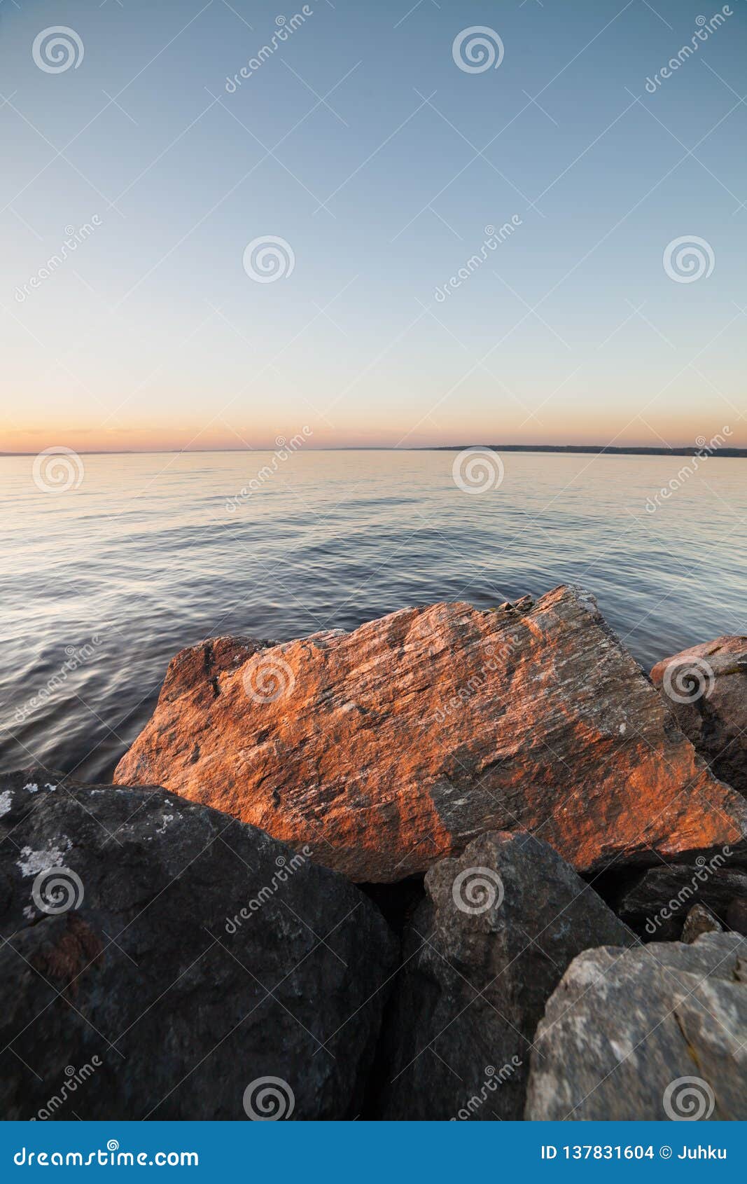 Rocks in Lake Shore at Sunset Stock Photo - Image of stone, sunlight ...