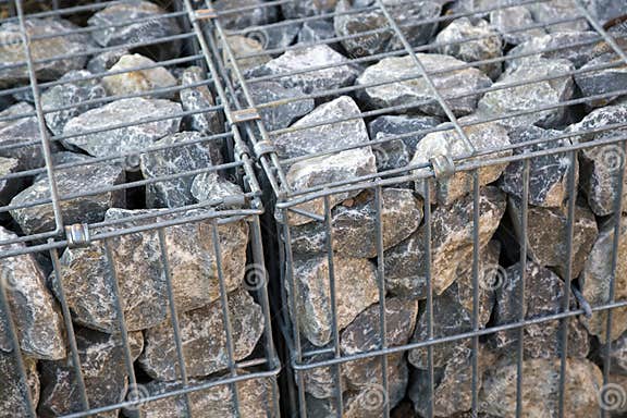 Rocks in a metal cage stock photo. Image of control, rock - 11559308