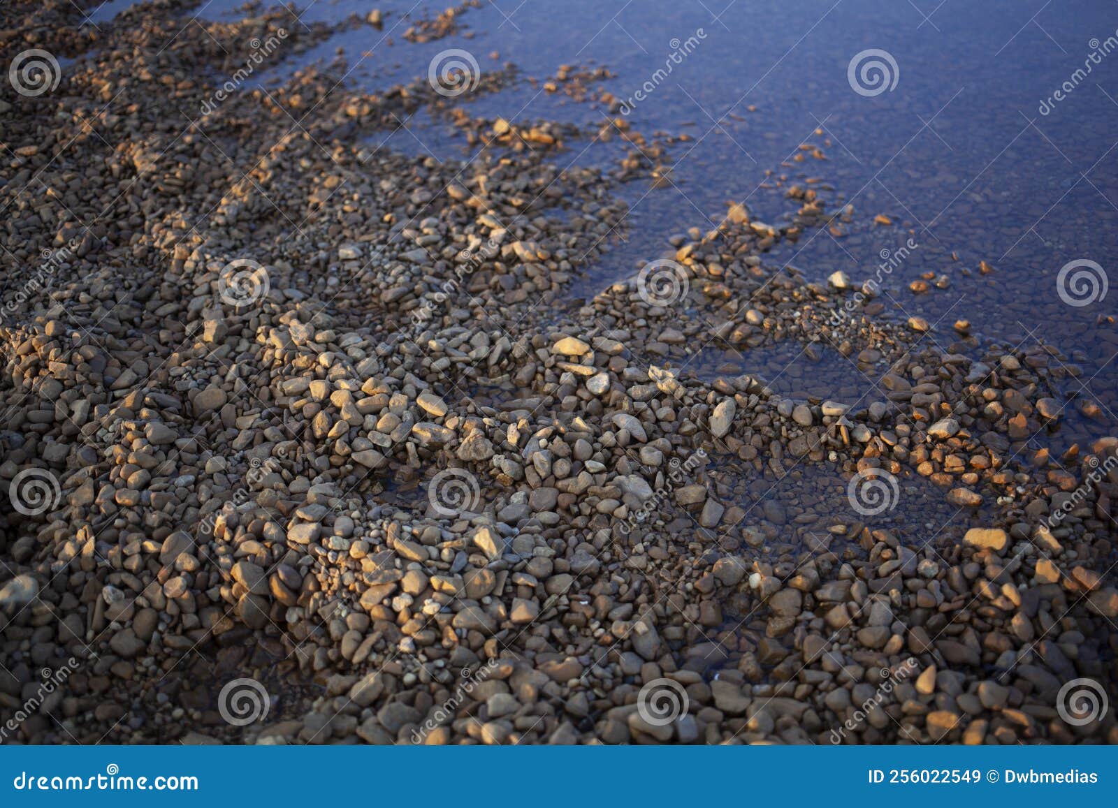 Rocks and Pebbles at the Lake Stock Image - Image of pattern, blue ...