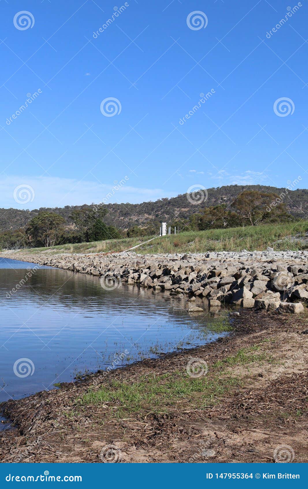 Rocks Placed at the Edge of a Lake during Construction Stock Photo ...