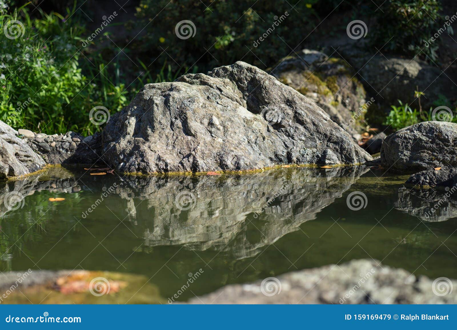 Rocks in a Creek Reflected in the Water. Stock Image - Image of ...