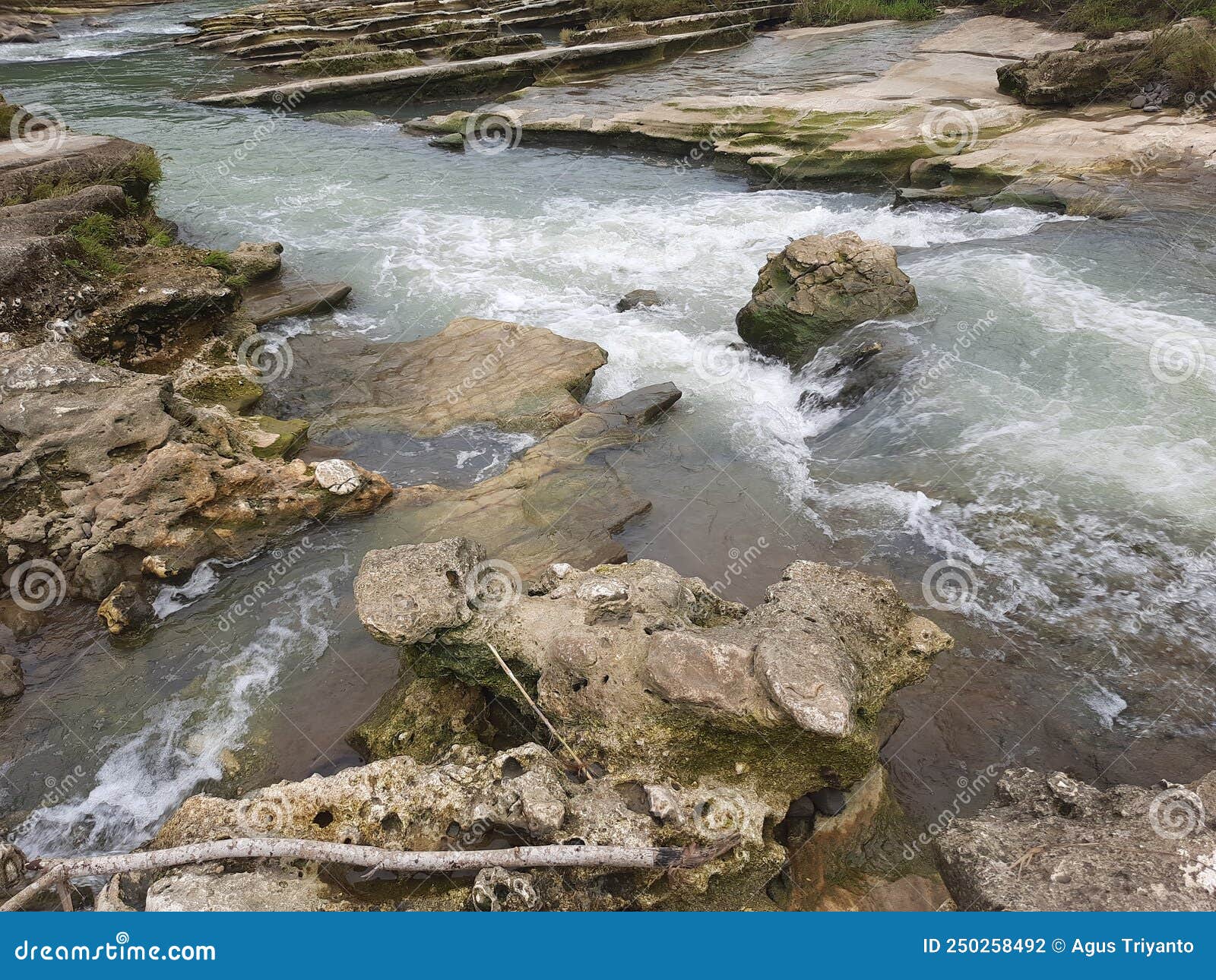 Rocks in the River with a Calm Water Flow Stock Photo - Image of shore ...