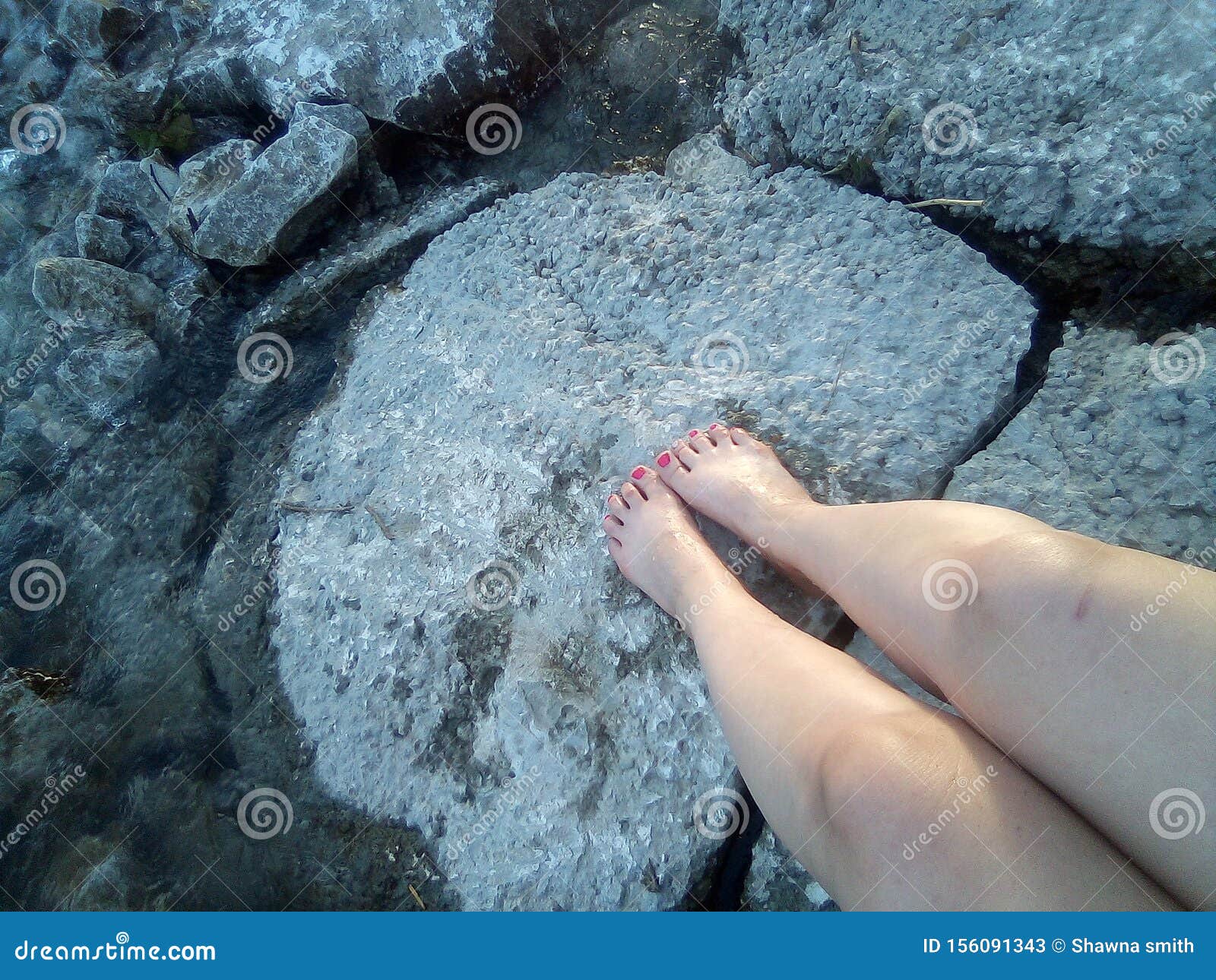 Rocks stock image. Image of toes, water, legs, rocks - 156091343