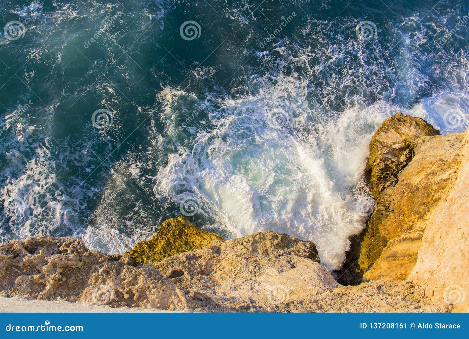 Rocks on the rough sea stock image. Image of coastline - 137208161