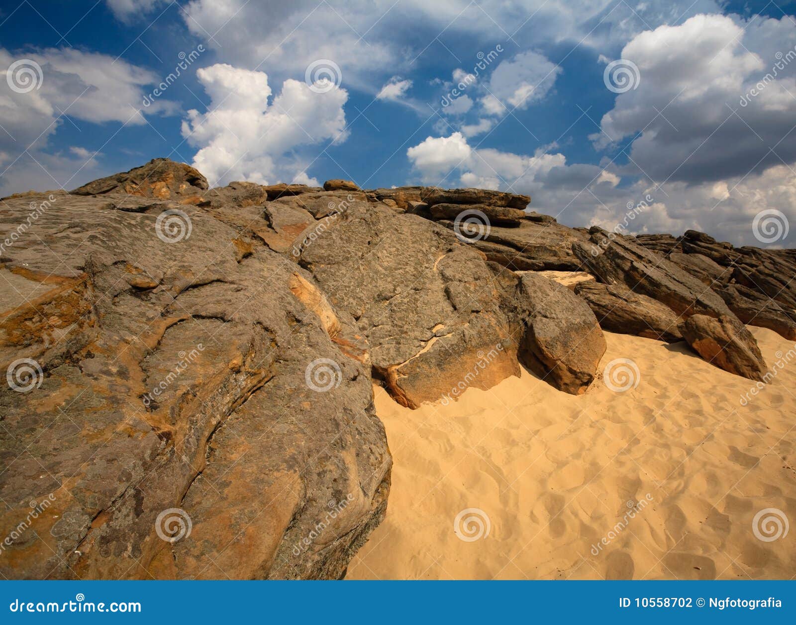 Rocks on sand stock photo. Image of brown, yellow, crack - 10558702